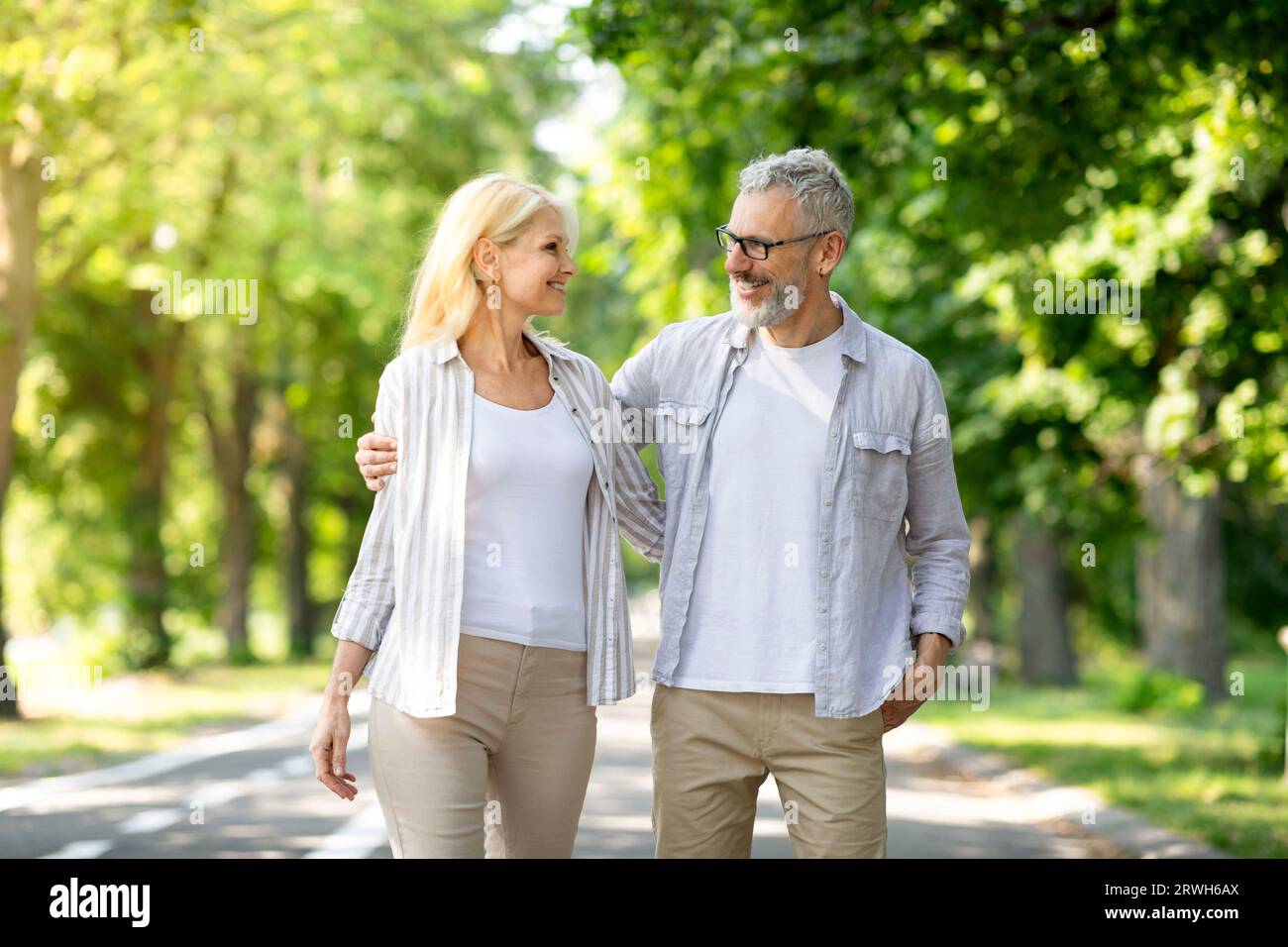 Portrait Of Beautiful Older Couple Walking Together In Summer Park ...