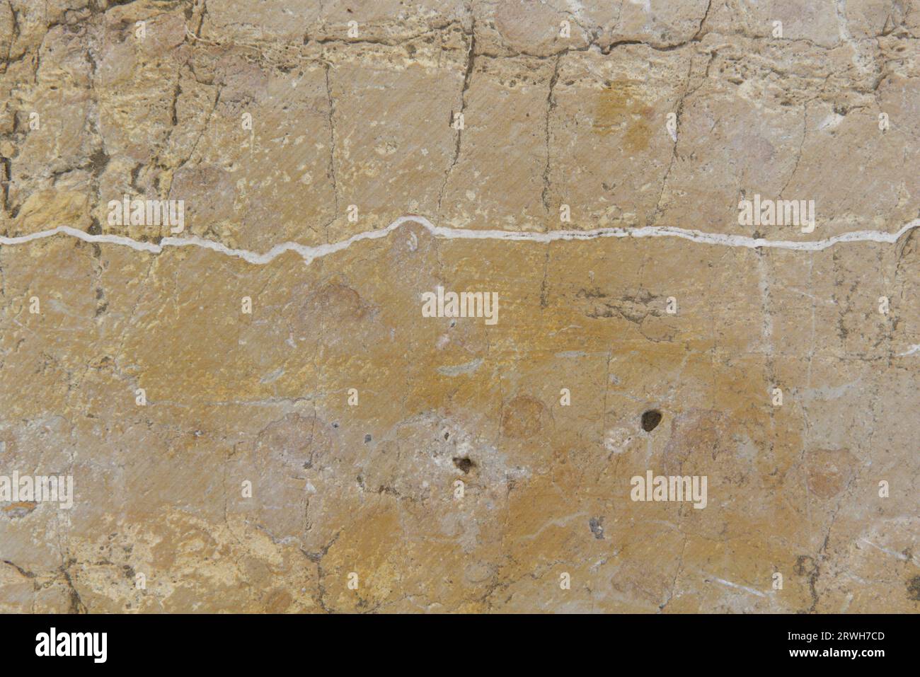 Yellow stone texture close-up with cracks and scratches Stock Photo - Alamy