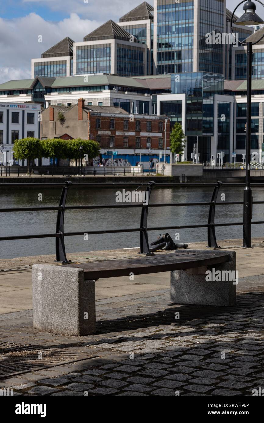 A standing bench in the shade among the trees on a walking route along ...