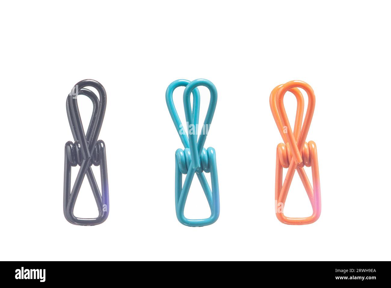 coloured pegs hanging closeup on a pure white background Stock Photo ...