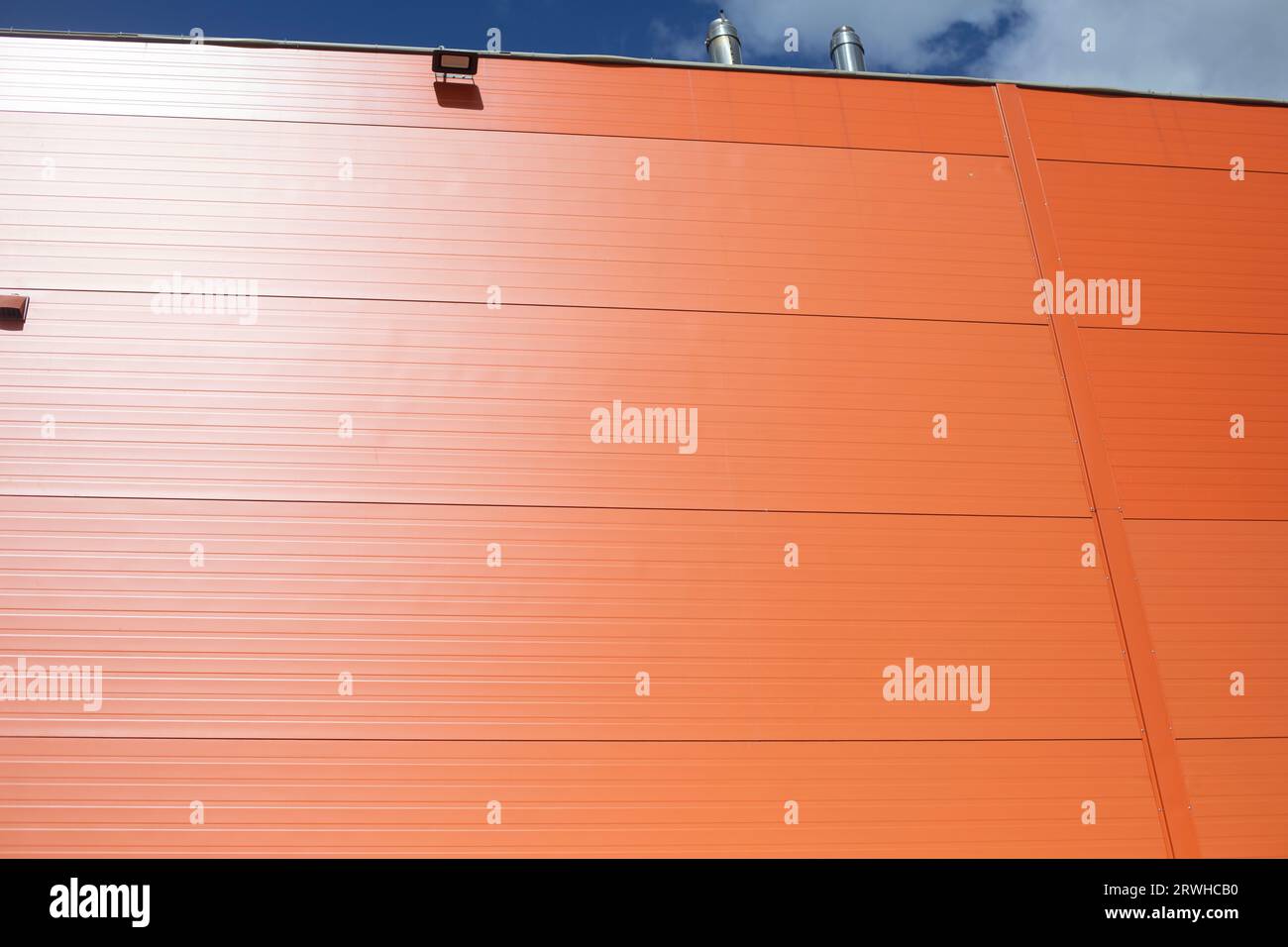 Orange wall without windows. There are no windows in building. Modern ...