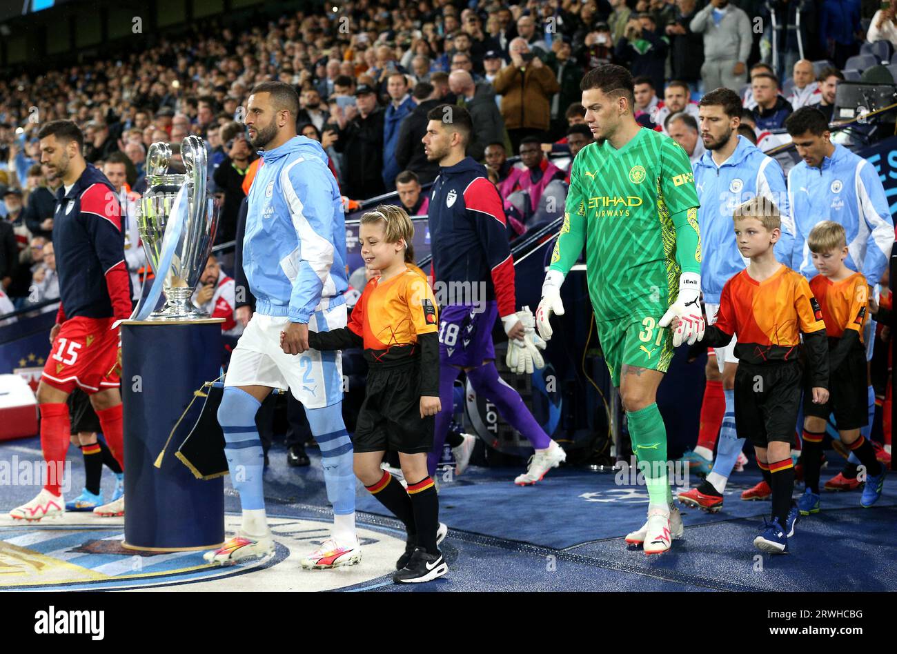 Manchester City's Kyle Walker and goalkeeper Ederson walk past the ...