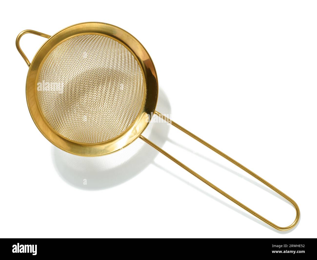 Golden strainer for bulk products on a white isolated background, top ...