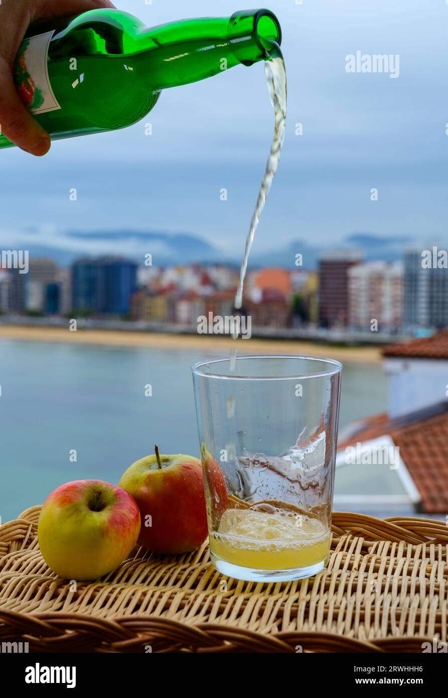 Traditional natural Asturian cider made from fermented apples in wooden ...