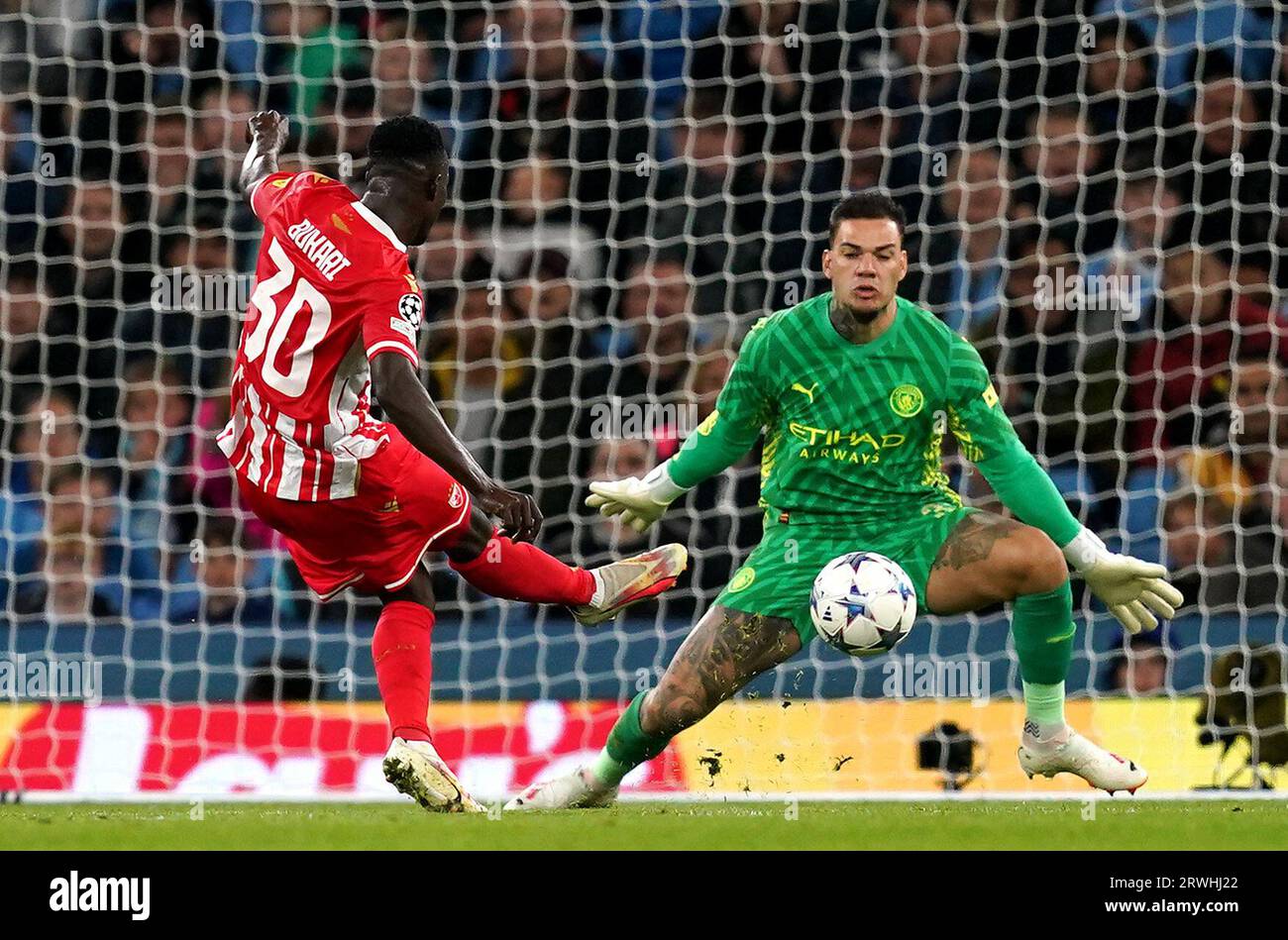 Red Star Belgrade's Osman Bukari (left) scores their side's first goal ...