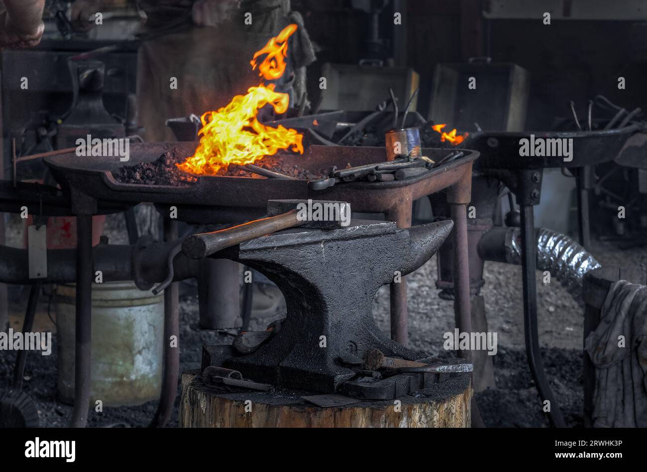 Blacksmith Forge and Tools - anvil and hammer in focus Stock Photo - Alamy