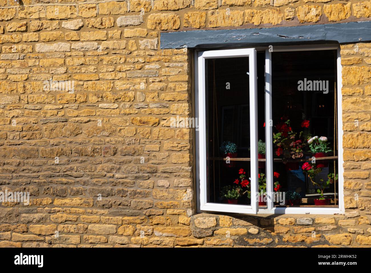 Side of a house with a single window with the road sign Victoria Street ...