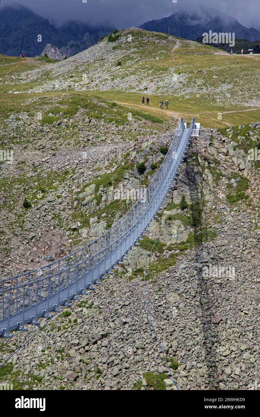 An himalayan pedestrian bridge allows hikers and tourists to access a ...