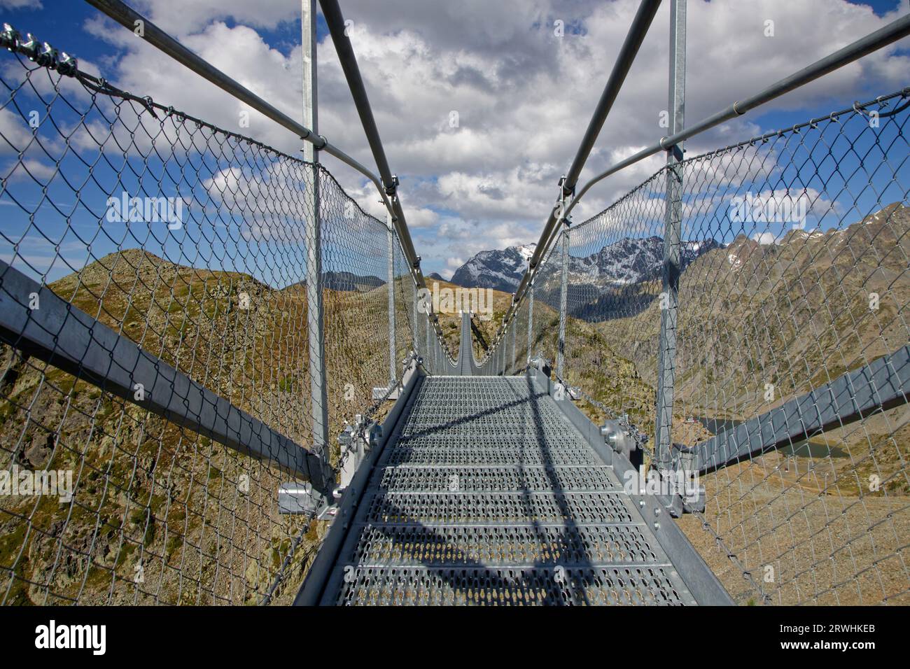 An himalayan pedestrian bridge allows hikers and tourists to access a ...