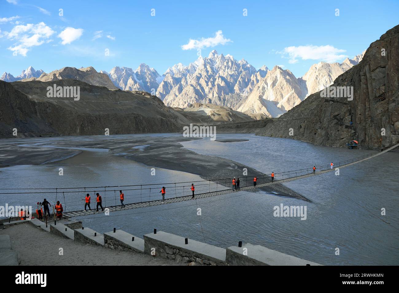 Tourists crossing the famous Hussaini Bridge in Pakistan Stock Photo ...