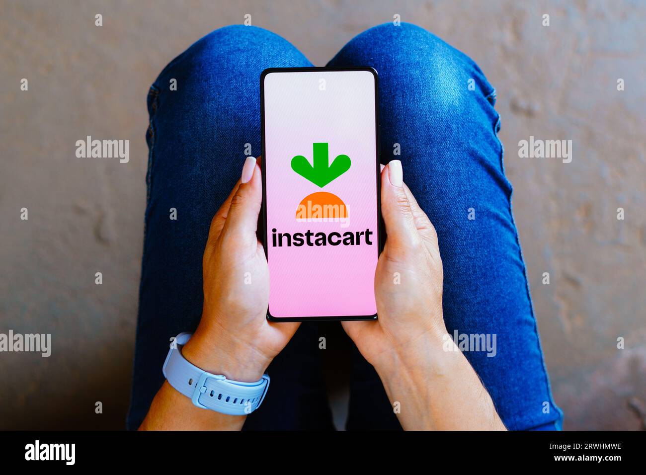 In this photo illustration, the Instacart logo is displayed on a ...