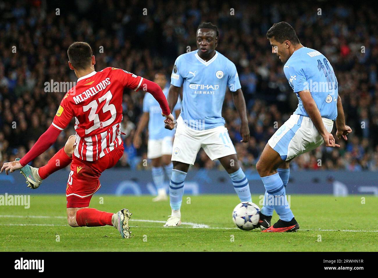 Manchester City's Rodri (right) scores their side's third goal of the ...