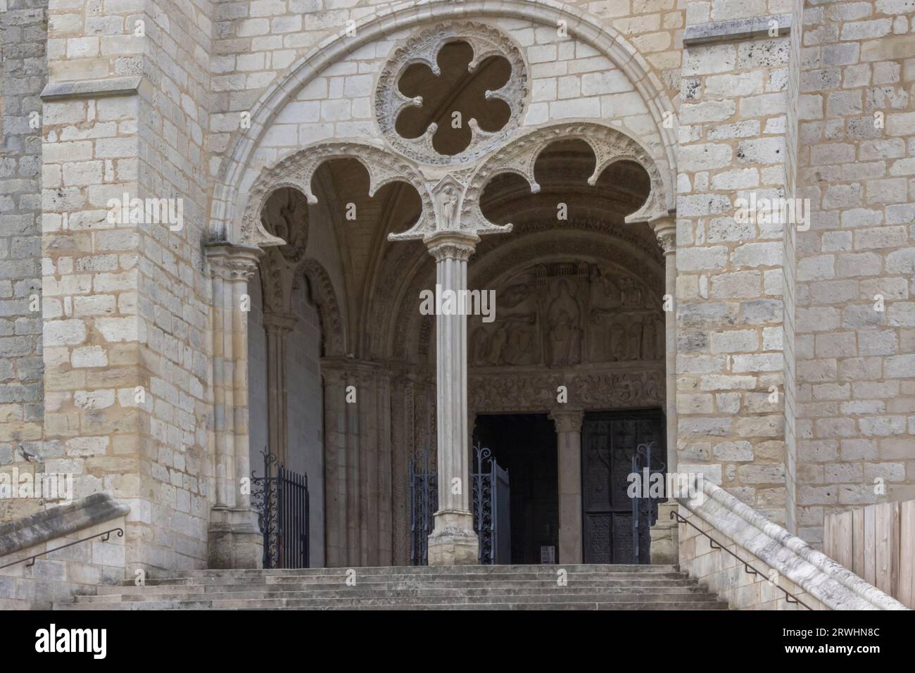 Unique cream stone doorway to a religious building at the top of some ...