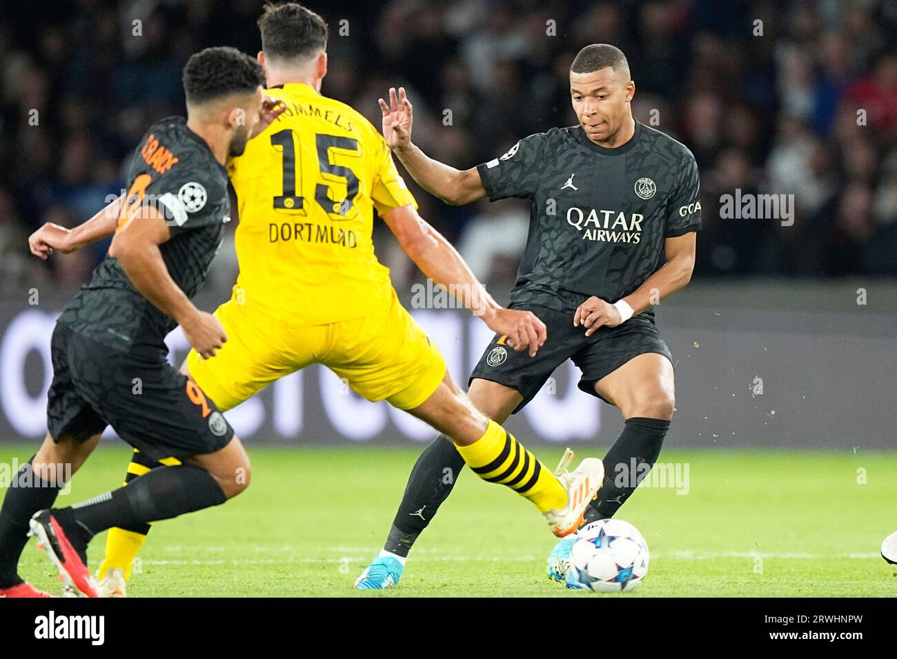 PSG's Kylian Mbappe, right, is challenged by Dortmund's Mats Hummels during the Champions League ...