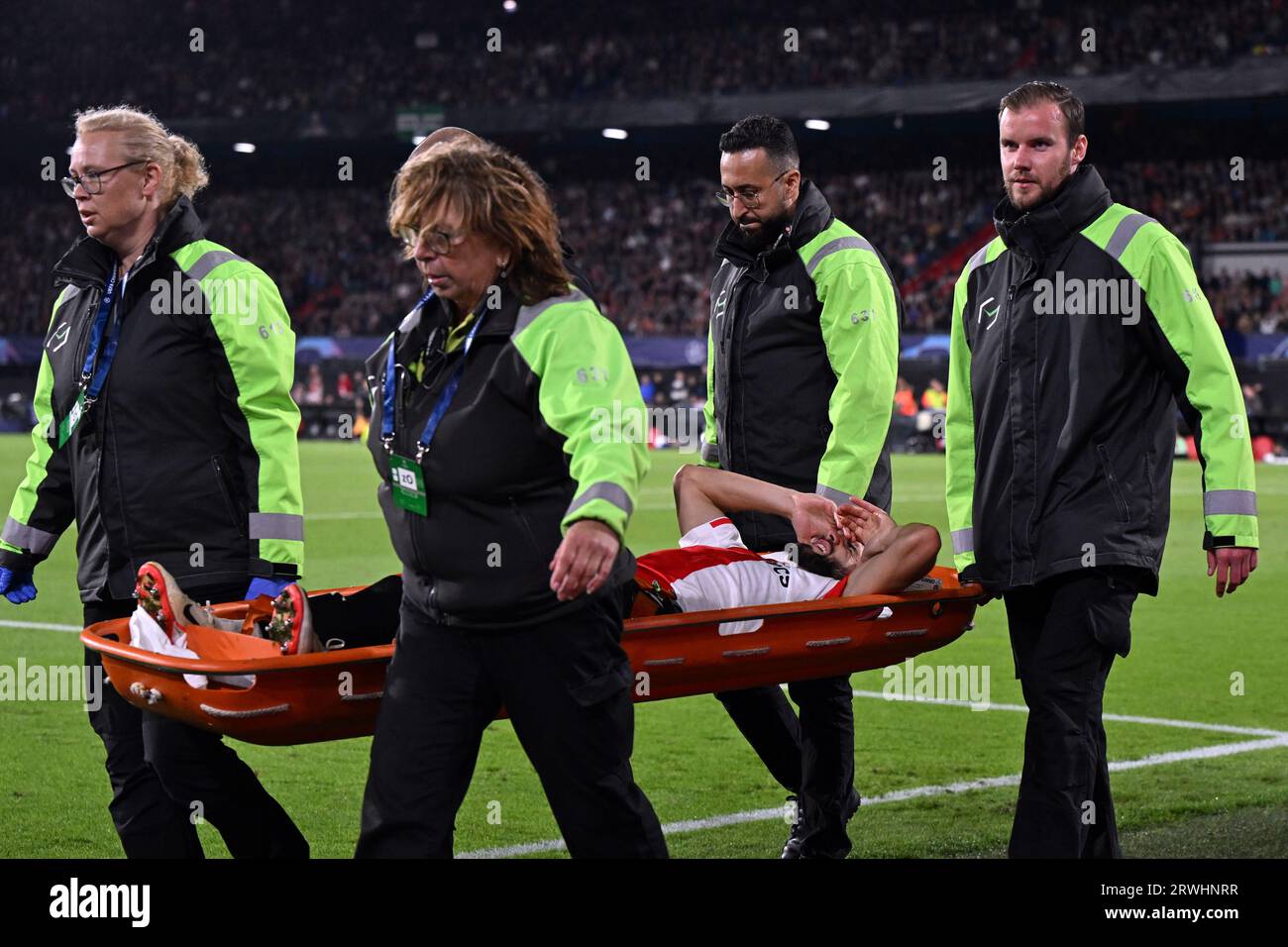ROTTERDAM - Luka Ivanusec of Feyenoord is carried off the field on a ...