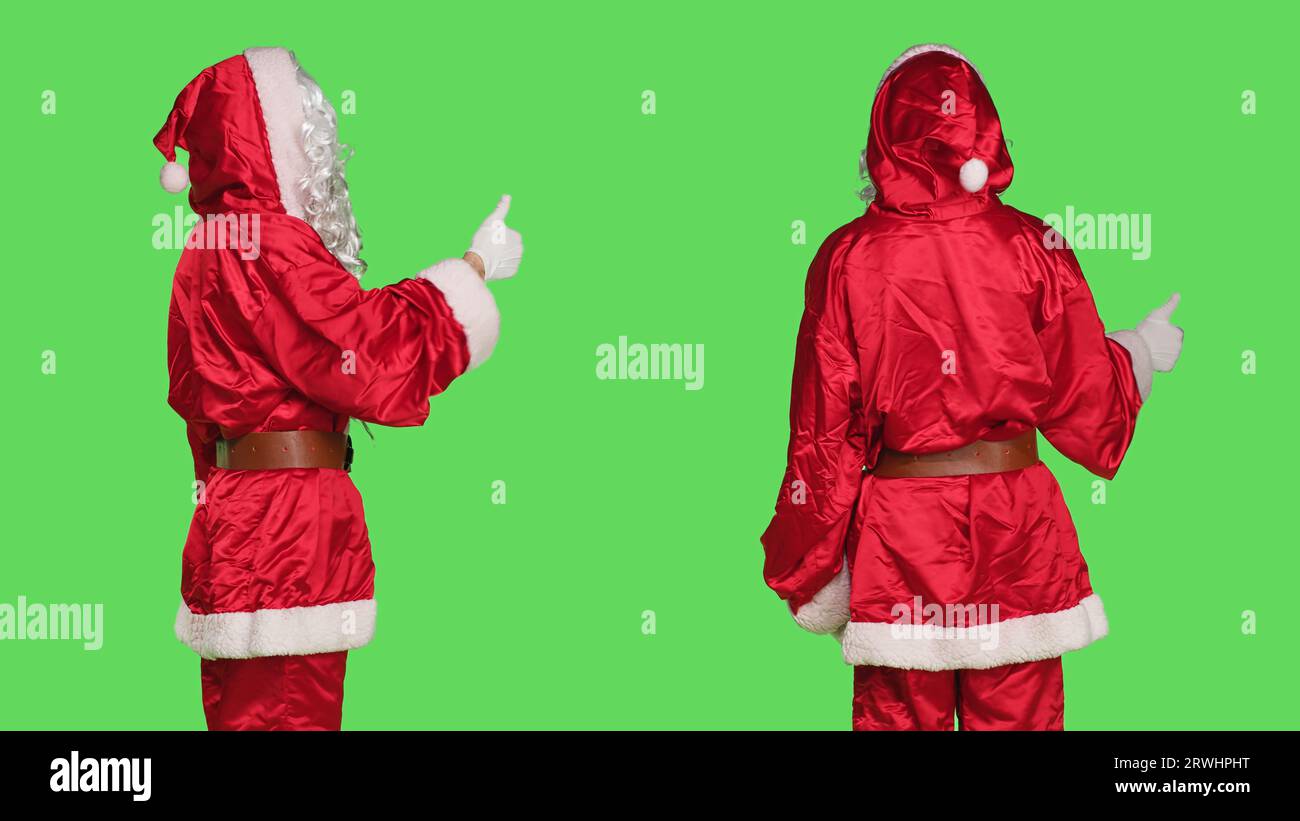 Saint nick shows thumbs up symbol while he wears festive costume with ...
