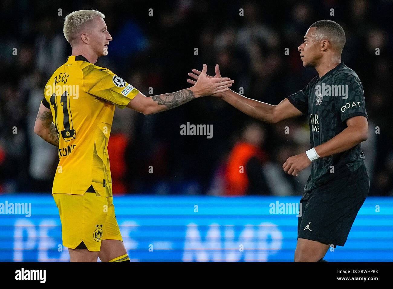 Dortmund's Marco Reus, left, congratulates PSG's Kylian Mbappe after ...