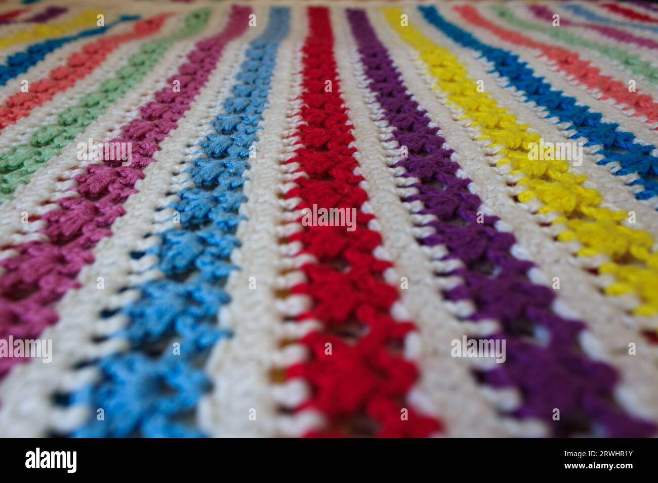Background crocheted fabric, pattern of multi-colored rows handmade ...