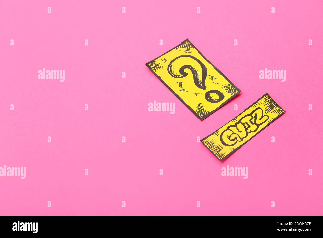 Paper quiz card with question mark on pink background Stock Photo - Alamy