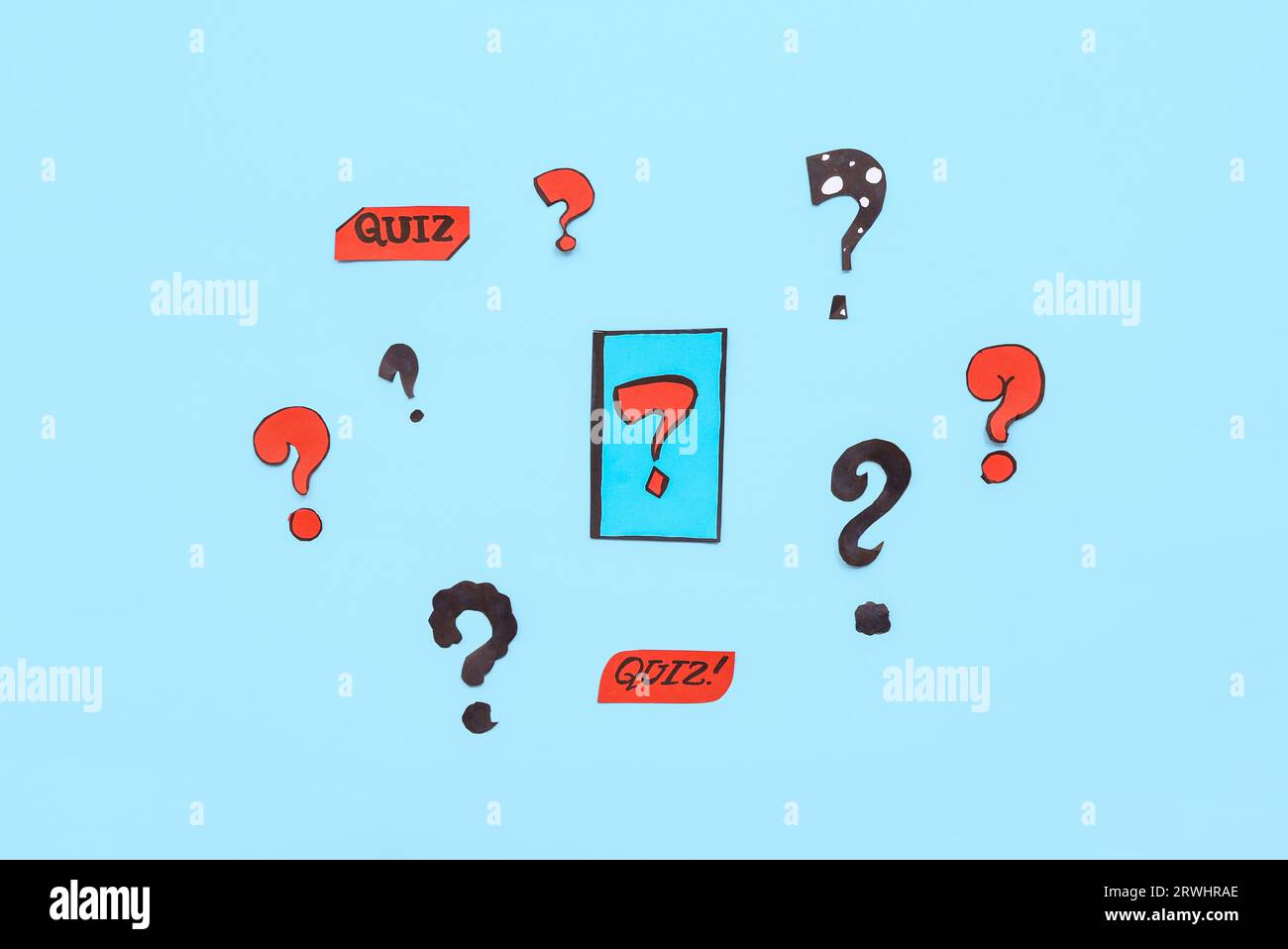 Paper quiz cards with question marks on blue background Stock Photo - Alamy