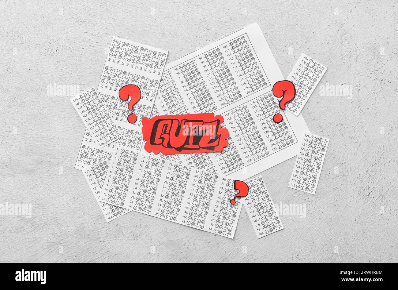 Quiz forms with paper quiz card and question marks on white background ...