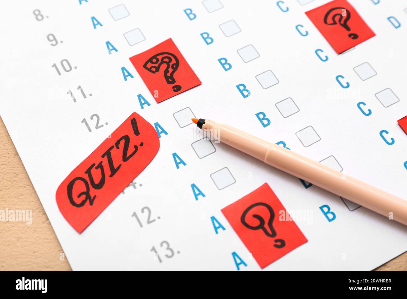 Quiz form with paper quiz cards and question marks on beige background ...
