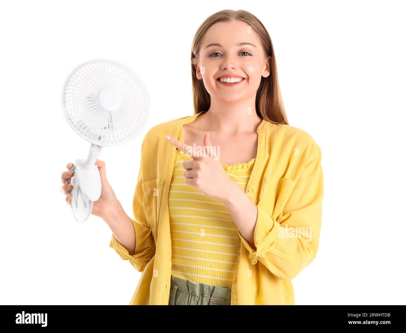 Young woman pointing at electric fan on white background Stock Photo ...