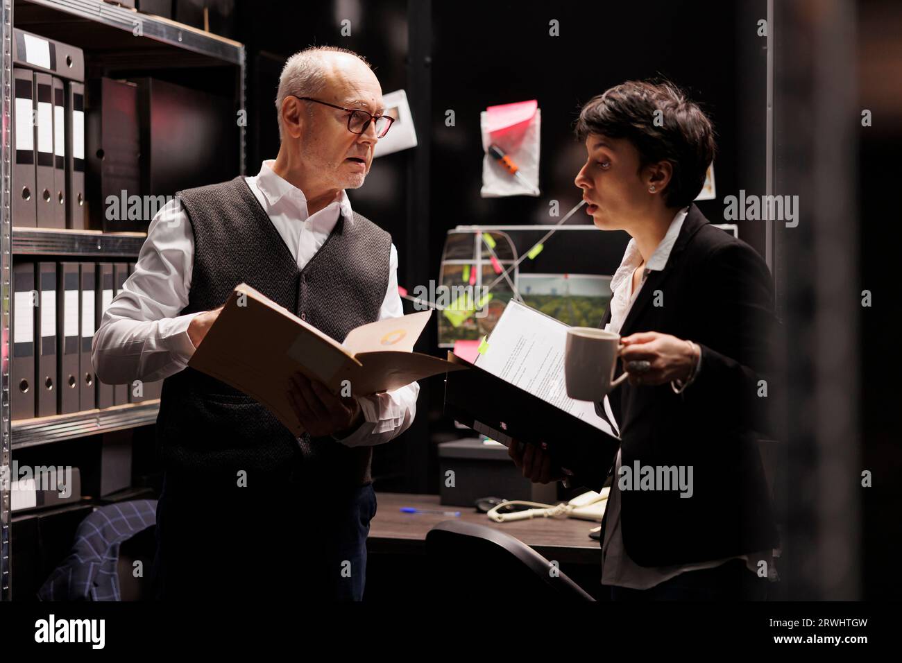 Police detective checking evidence list hi-res stock photography and ...