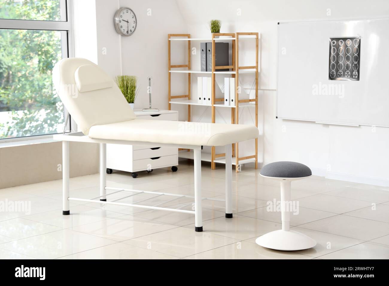 Interior of modern medical office with examination couch in clinic ...