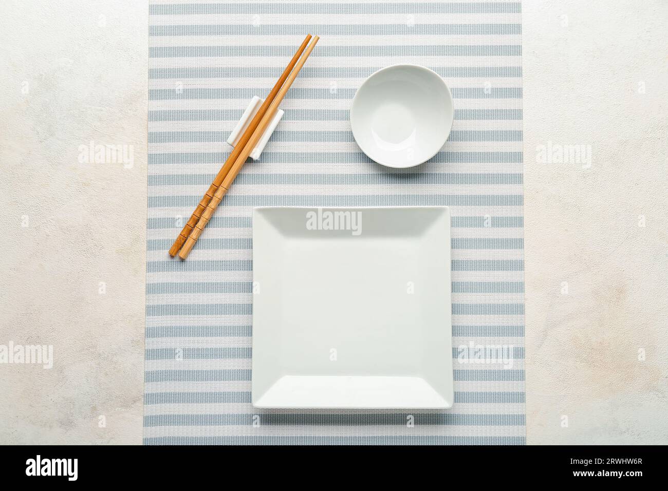 Chinese table setting on light background Stock Photo - Alamy