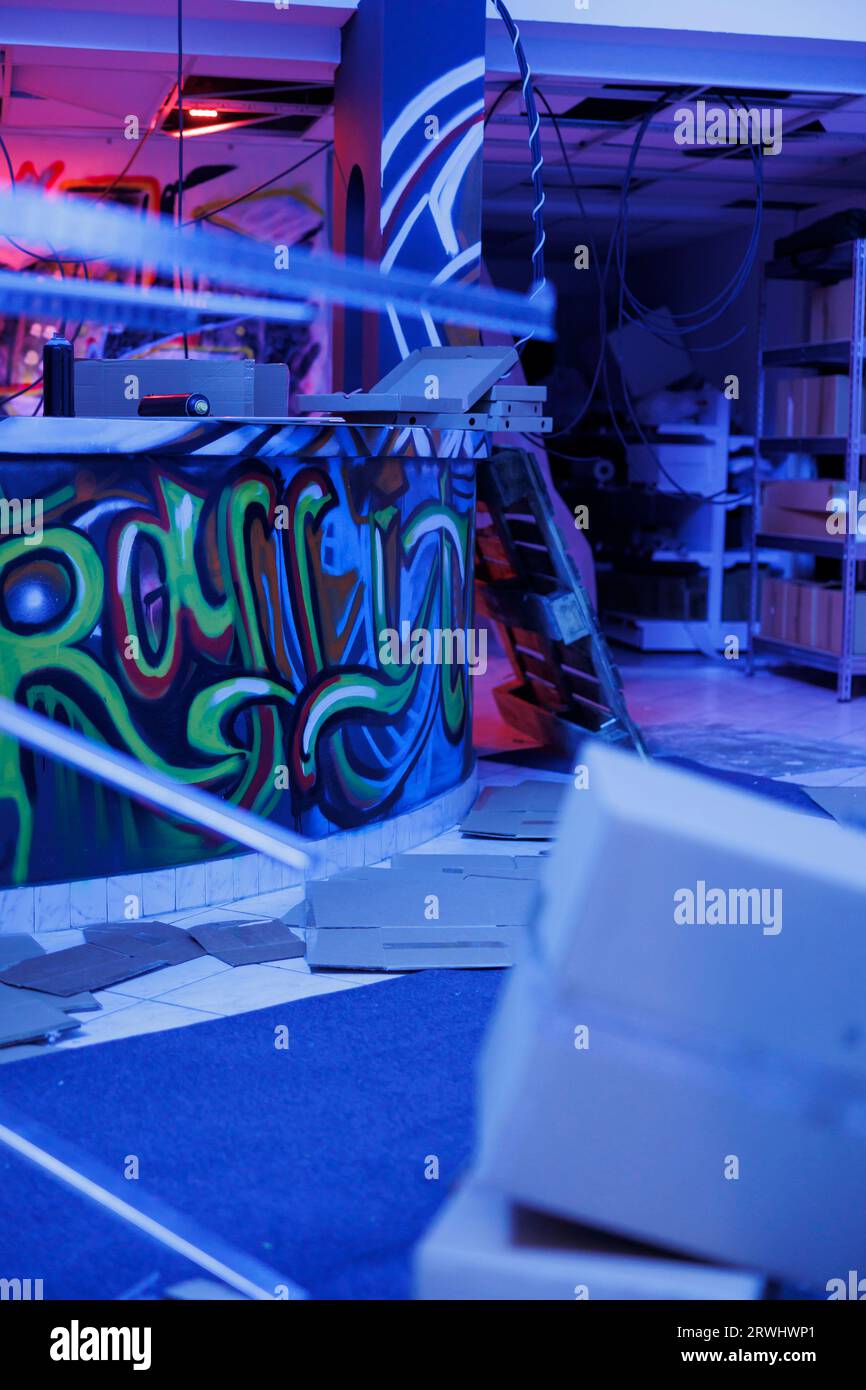 Messy structure of building with purple neon lights in state of ...