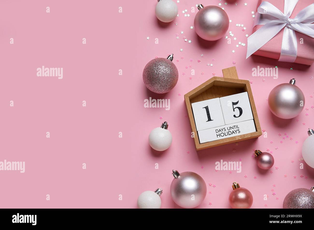 Composition with countdown calendar, Christmas balls and gift box on ...
