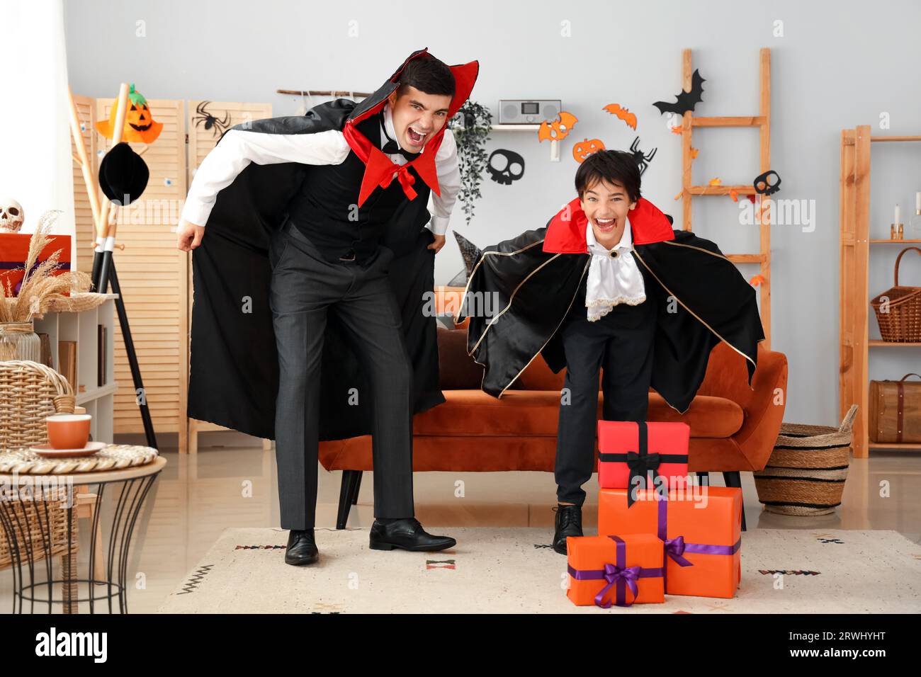 Scary little boy and his father dressed for Halloween as vampires at ...