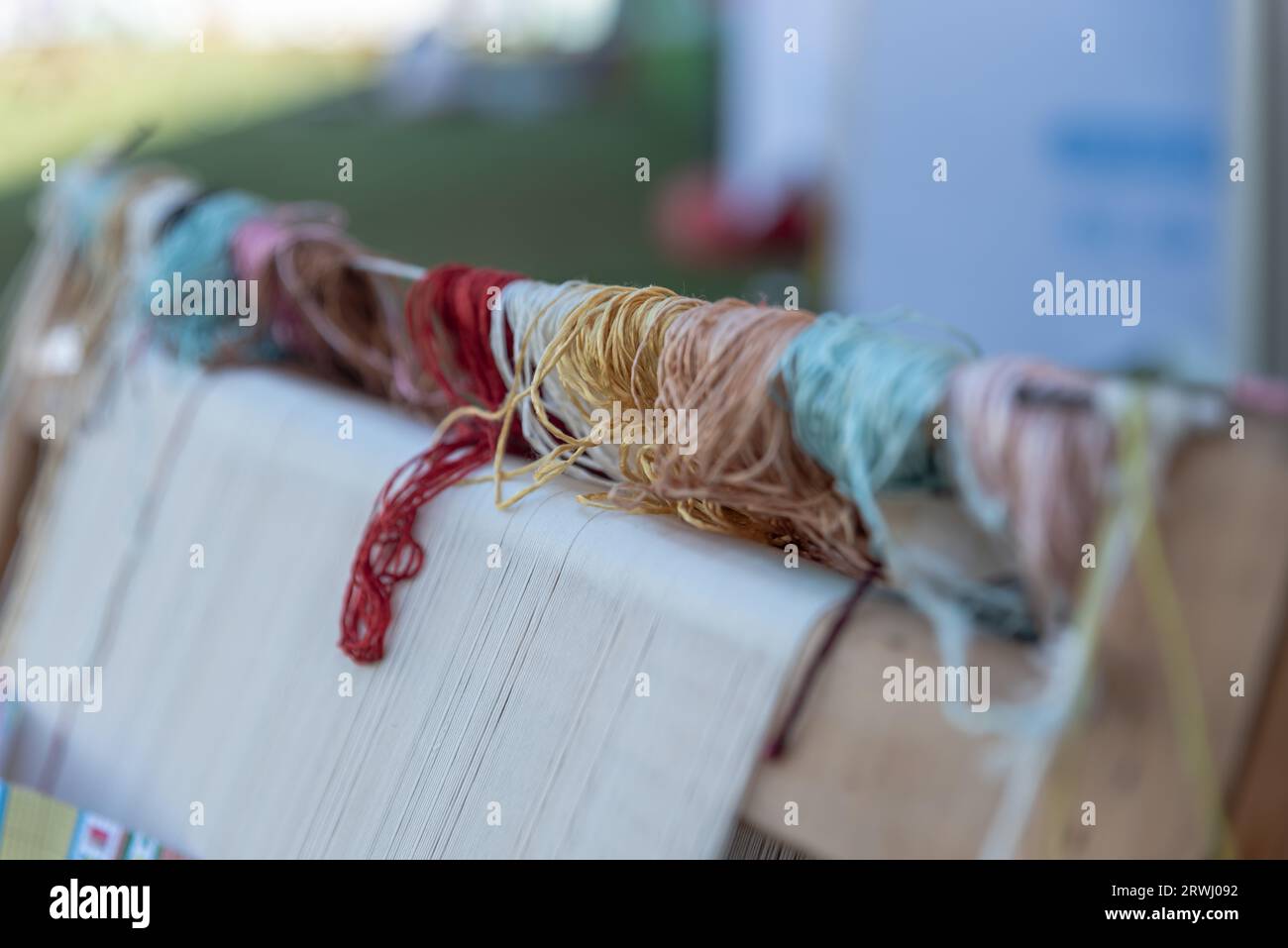 Carpet weaving using traditional techniques on a loom. , close-up of ...