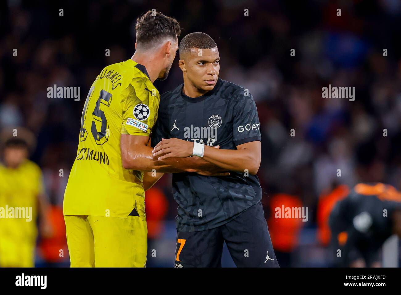 PARIS, FRANCE - SEPTEMBER 19: Mats Hummels (Borussia Dortmund) and Kylian Mbappe (Paris Saint ...