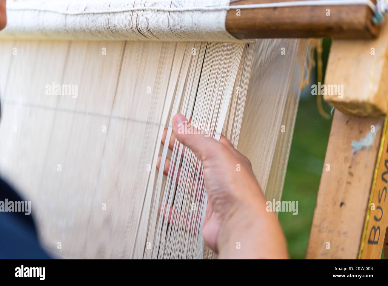 Carpet weaving using traditional techniques on a loom. , close-up of ...