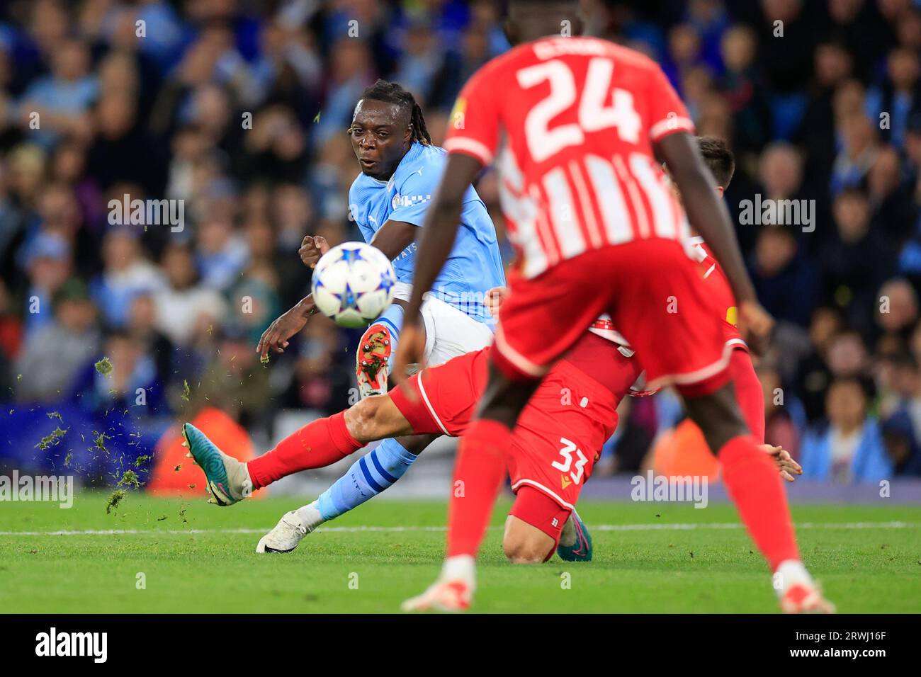 Jeremy Doku #11 of Manchester City crosses the ball during the UEFA ...