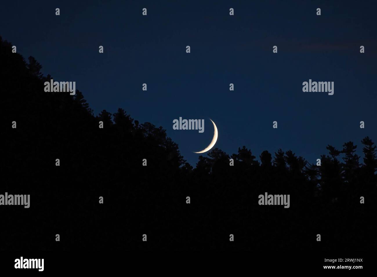 General view of crescent moon rising over the mountain in Kokernag area ...