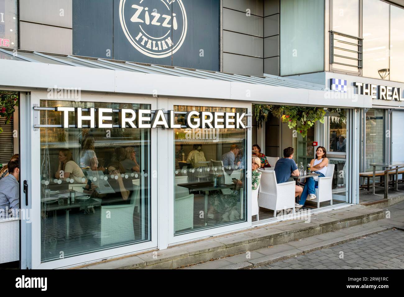 People Sitting Down By The River Thames Inside The Real Greek ...