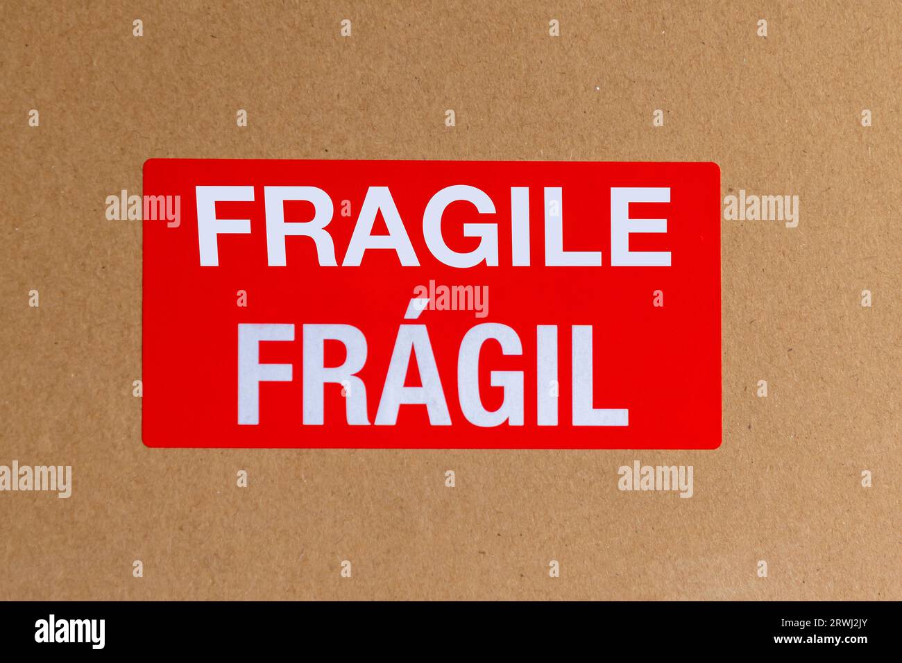 Red sticker with fragile word on cardboard transport box Stock Photo ...