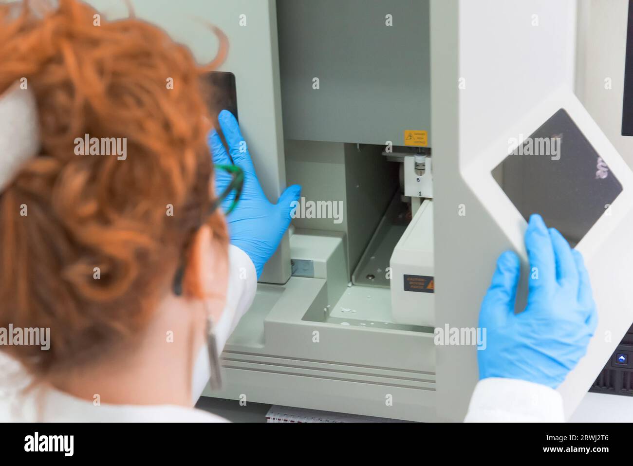 Research scientist using micro pipette for test analysis in modern ...