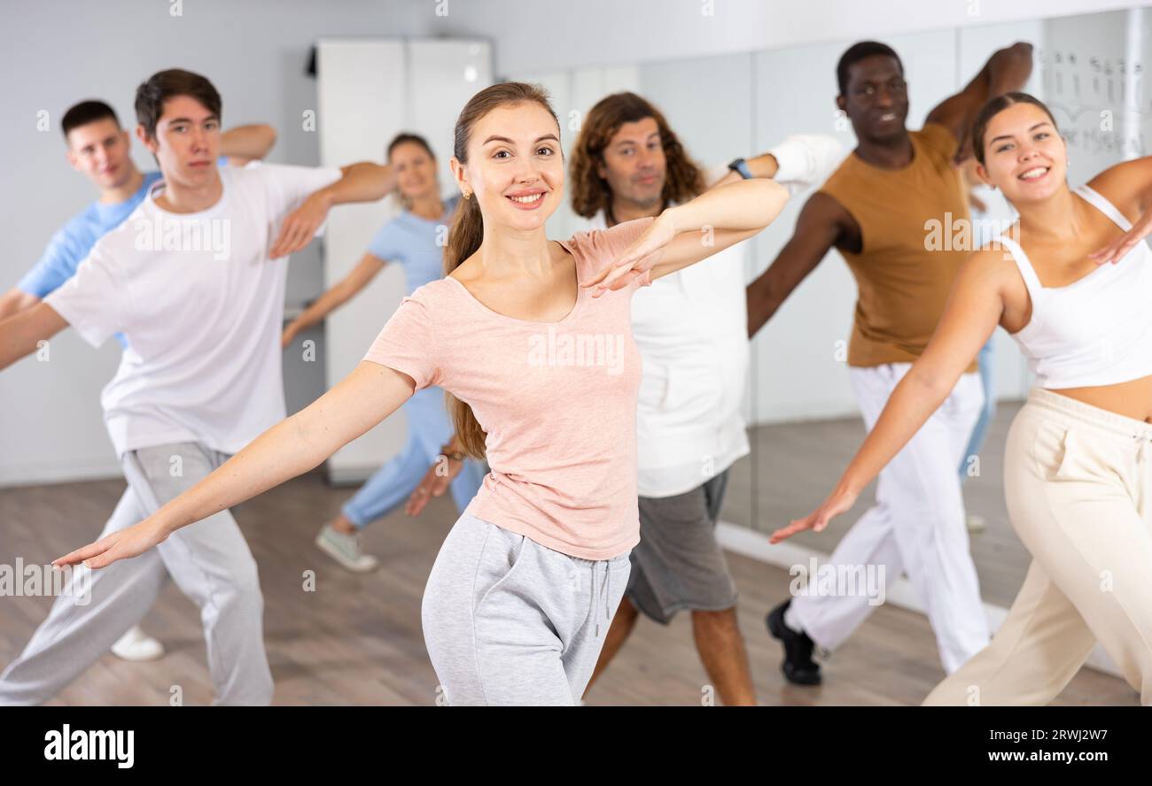 Group of different people rehearsing dance in dance studio Stock Photo ...