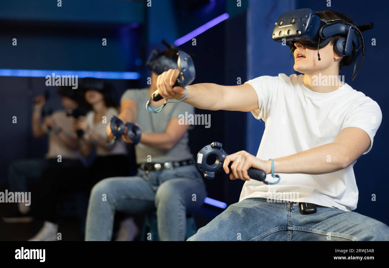 Man in virtual reality glasses controls superhero with joystick in ...