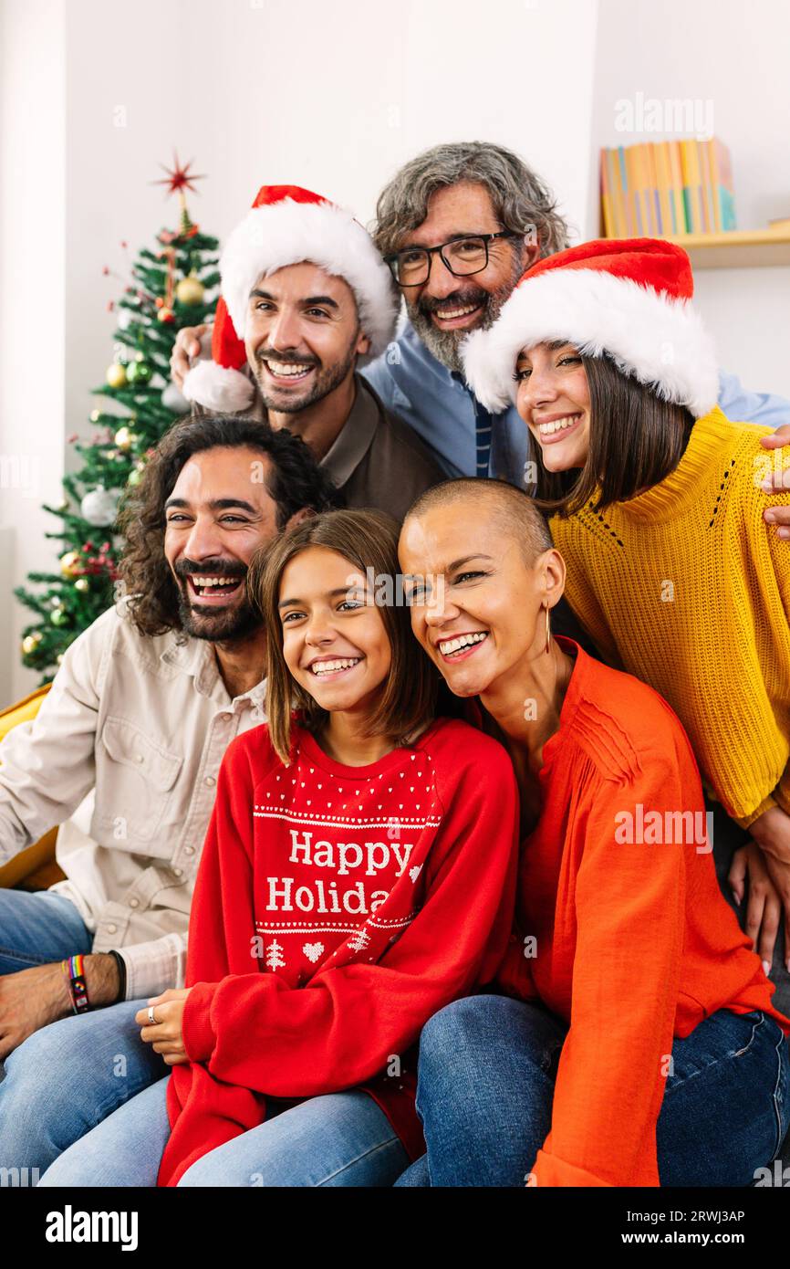Vertical portrait of multi generational family celebrating christmas ...