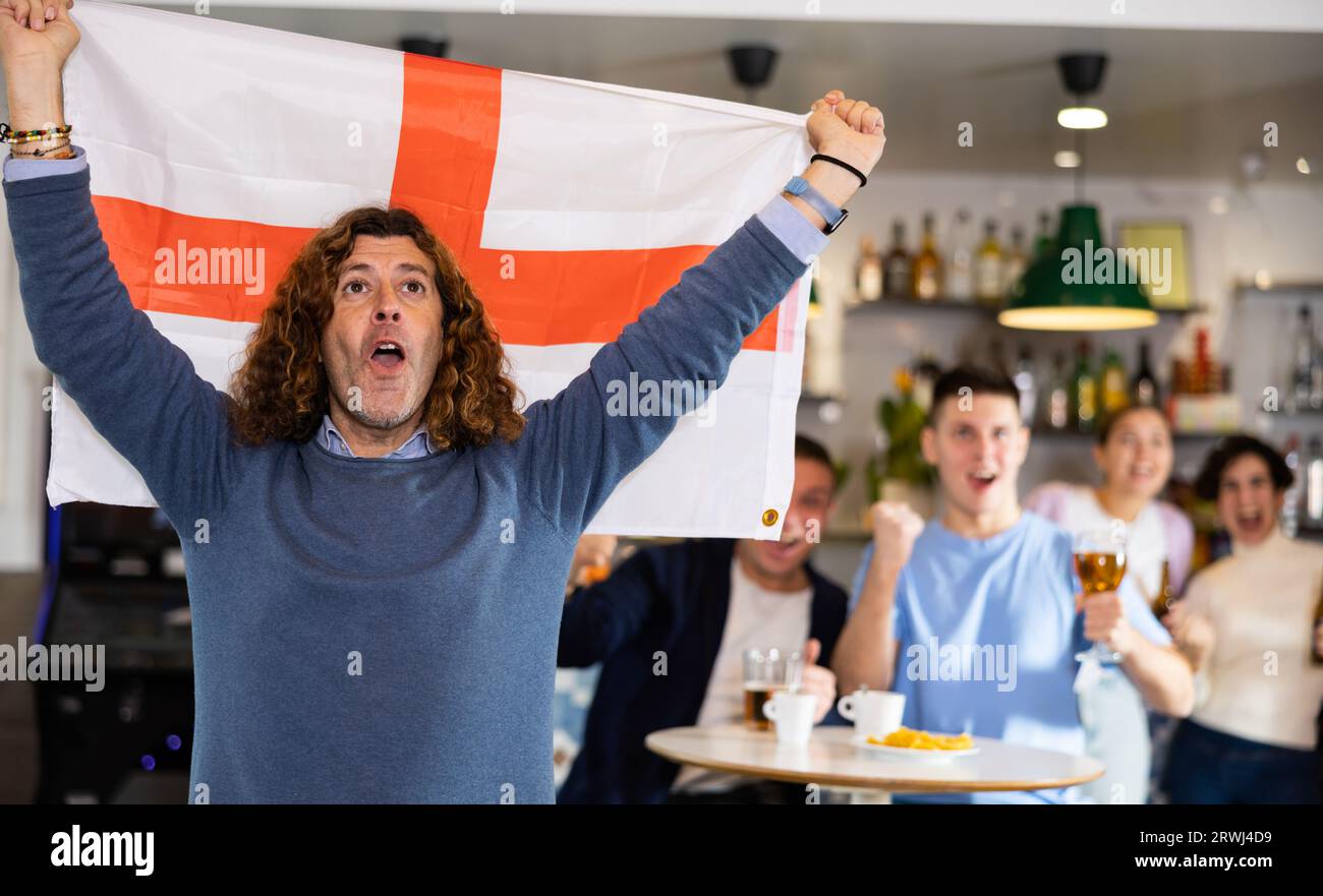 Group of friends, sports supporters cheering for favorite team with ...