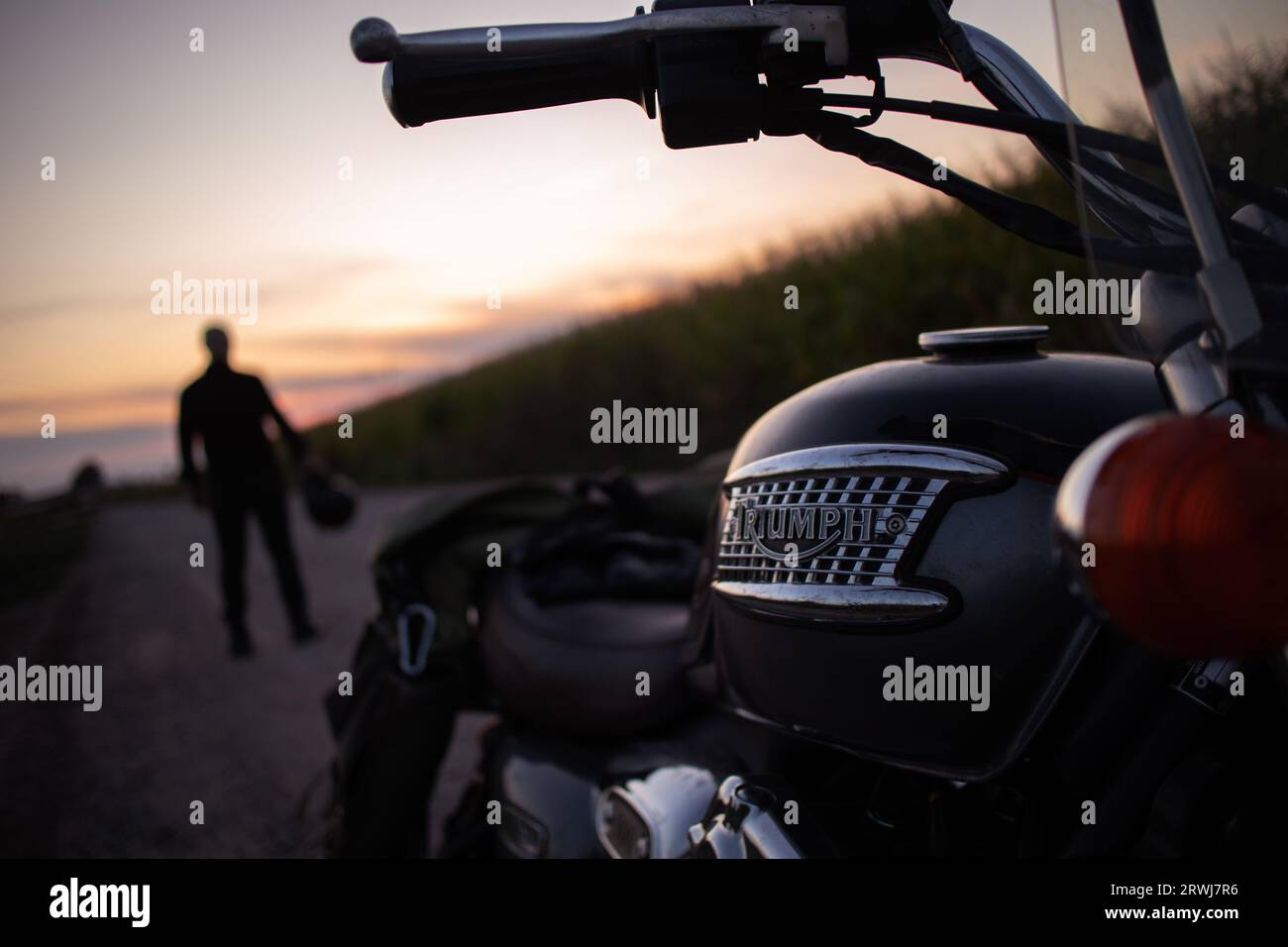 Triumph motorcycle sunset biker perspective Stock Photo - Alamy