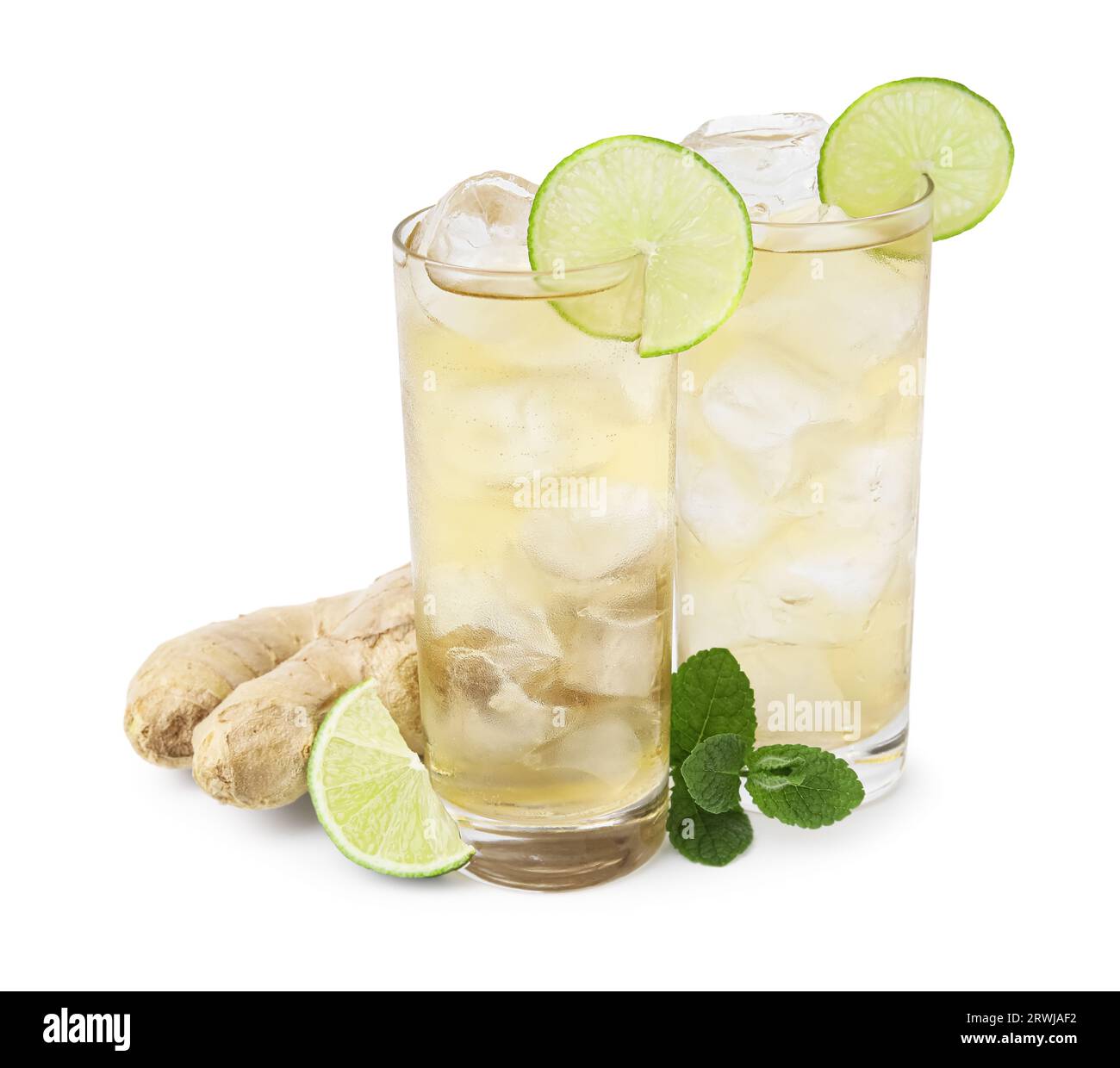 Glasses of tasty ginger ale with ice cubes and ingredients isolated on ...
