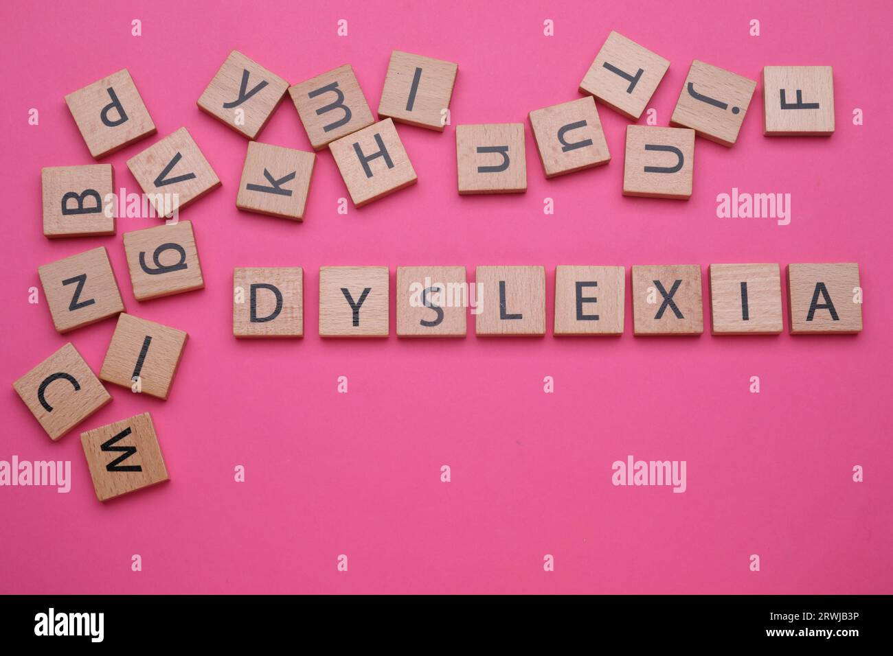Wooden cubes with word Dyslexia on pink background, flat lay Stock ...