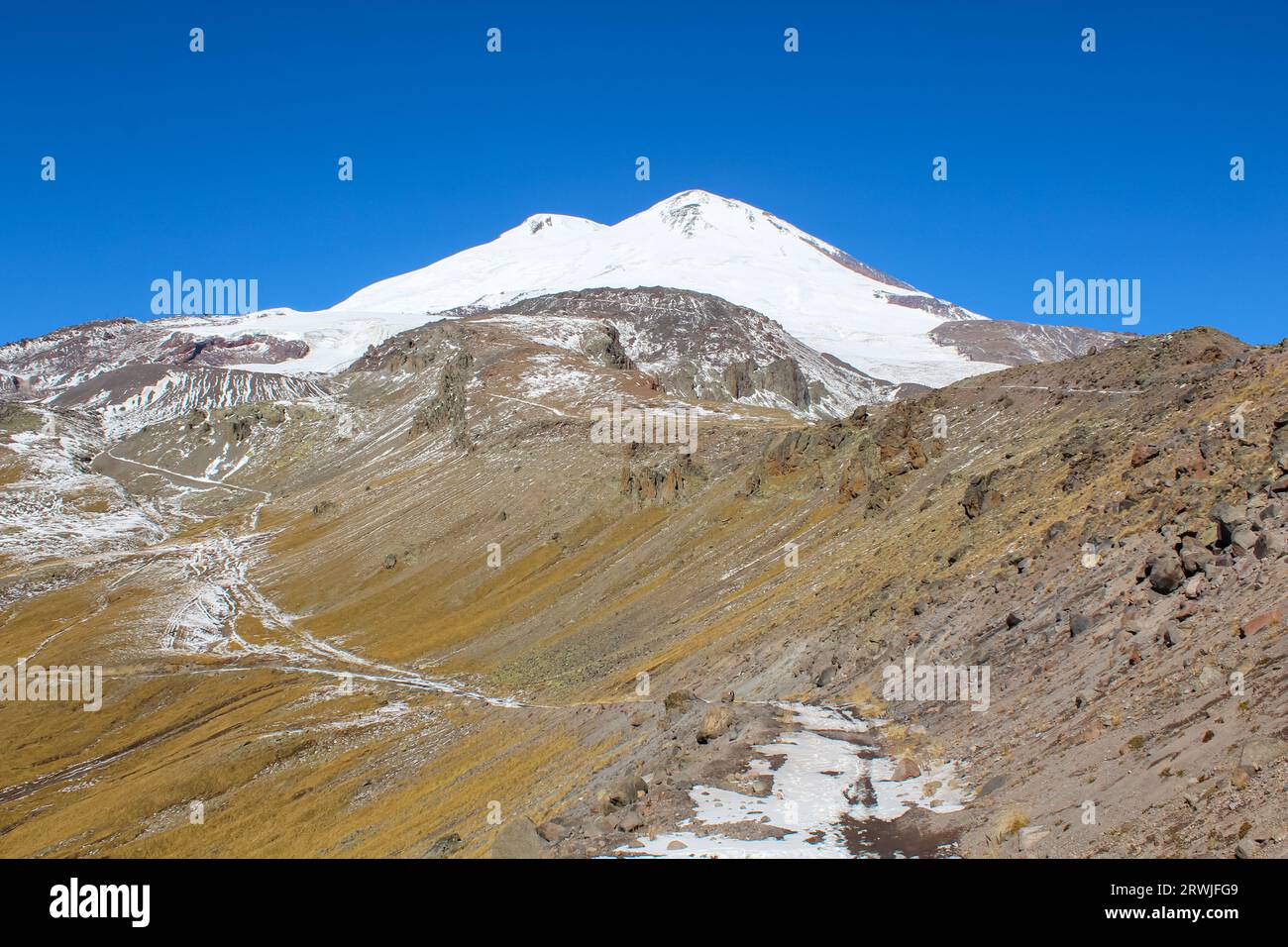 Double peak of Mount Elbrus, the highest mountain in Europe, blue sky ...