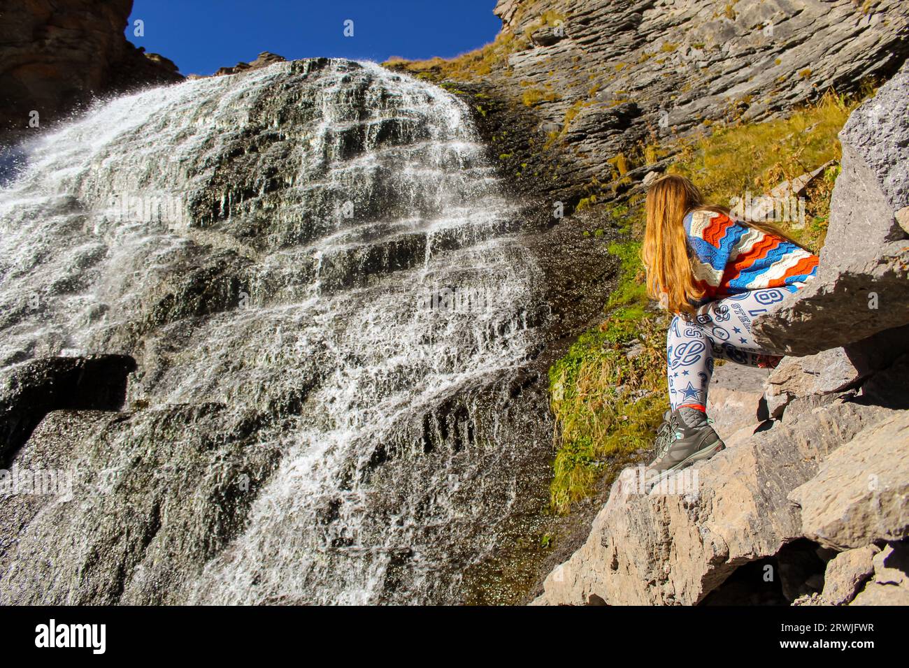 The girl sitting next to the waterfall The Maiden's tears in Elbrus ...